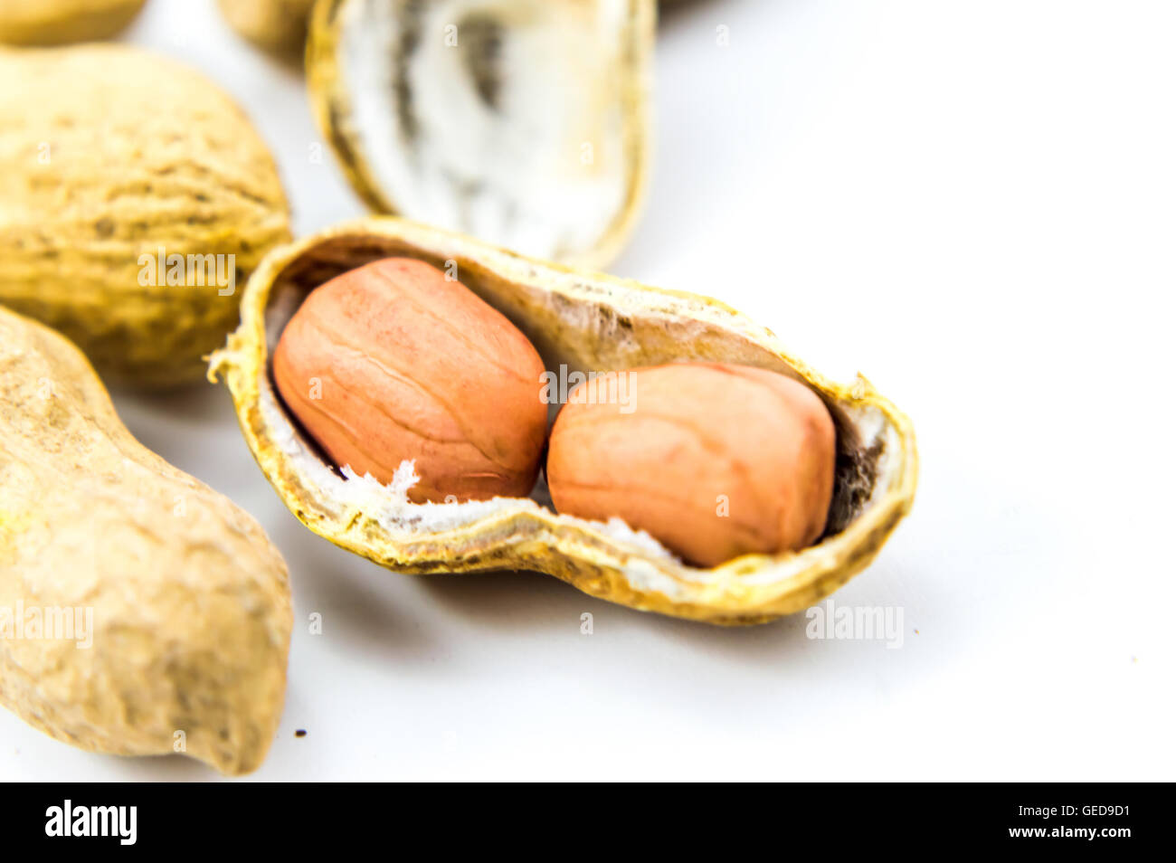 peanuts on white Stock Photo - Alamy