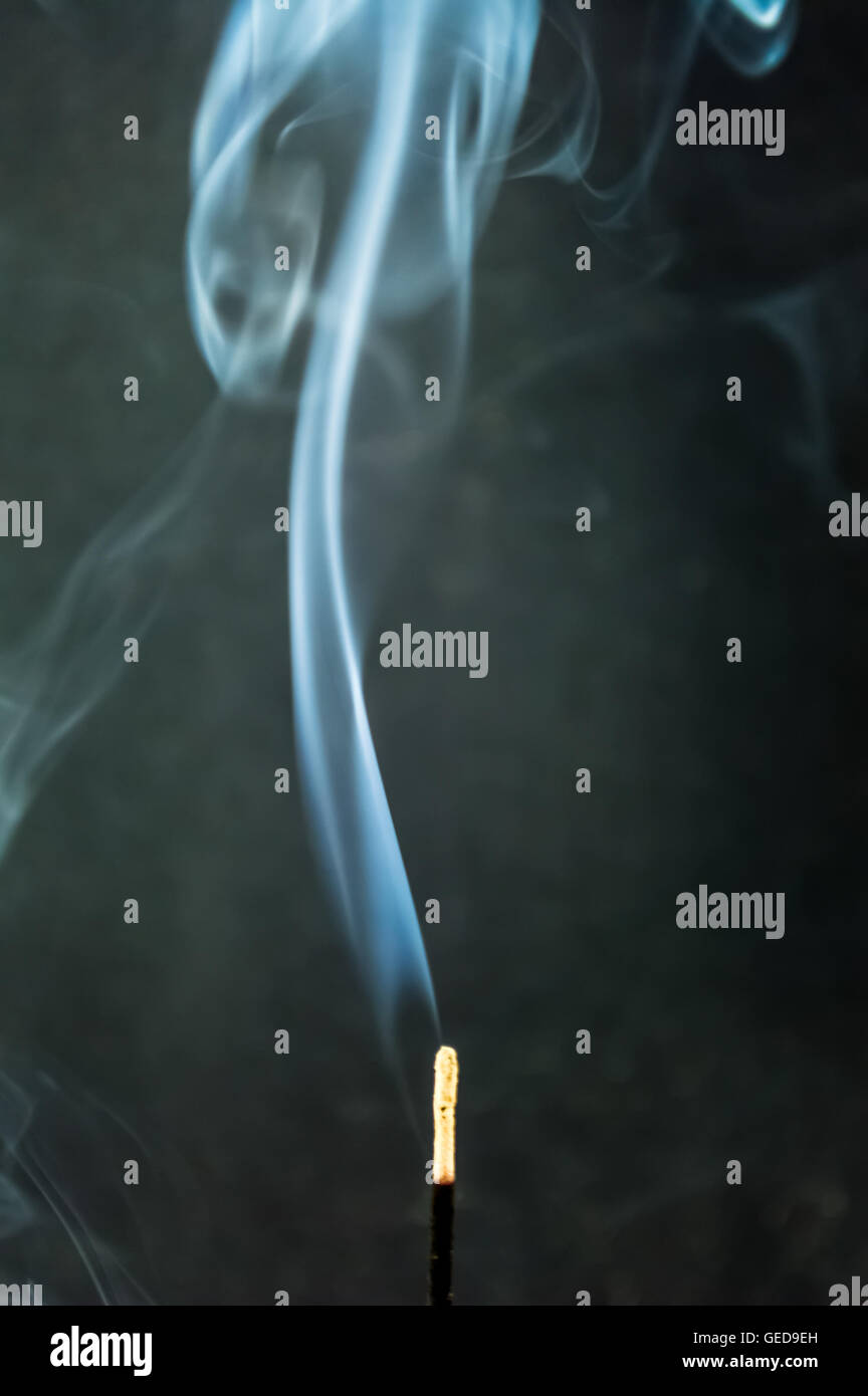 incense sticks smoke on black background Stock Photo - Alamy