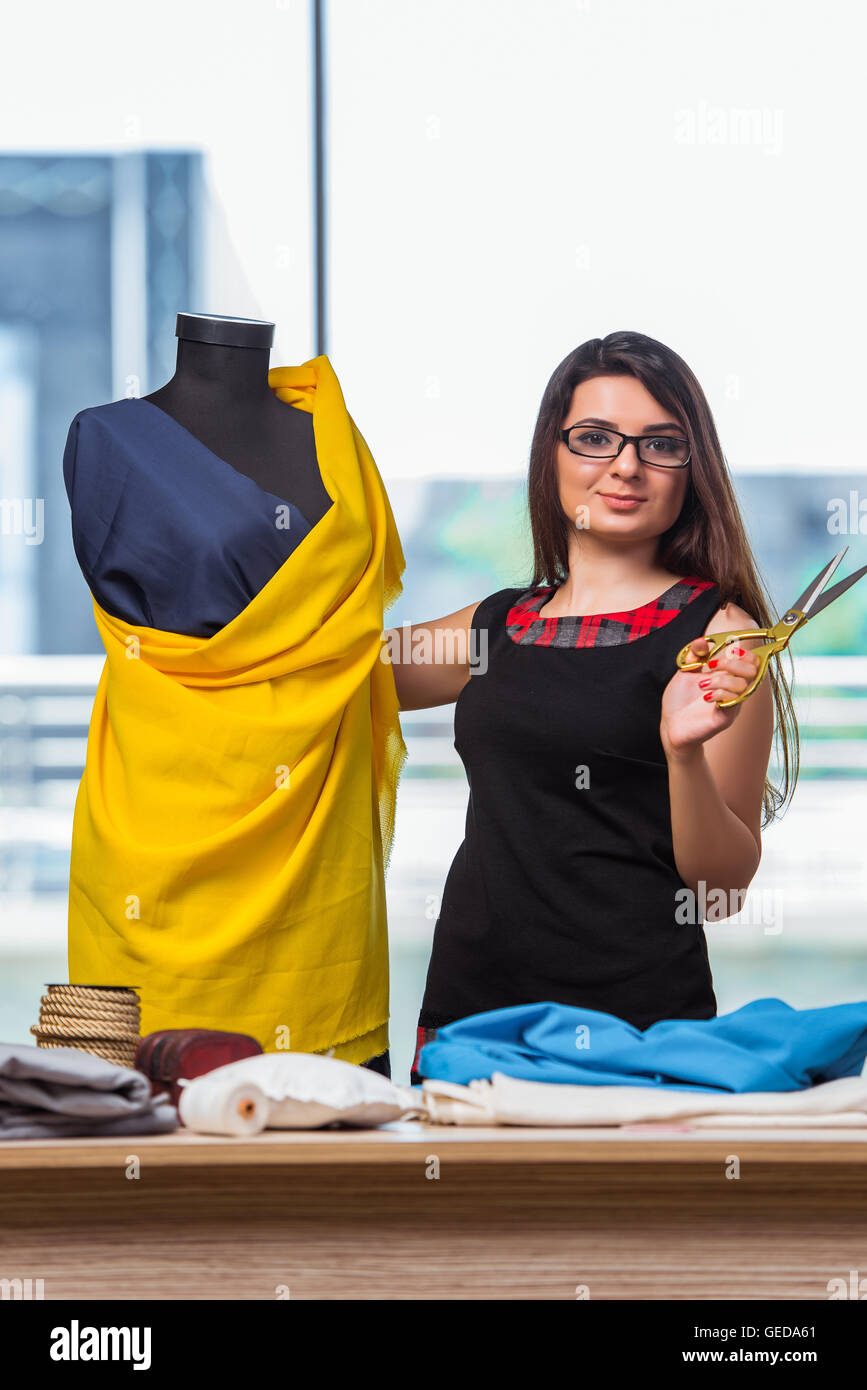 Woman tailor working on new clothing Stock Photo - Alamy