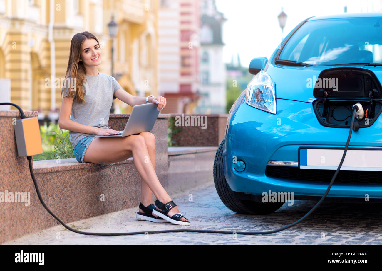 Lady charging car hi-res stock photography and images - Alamy