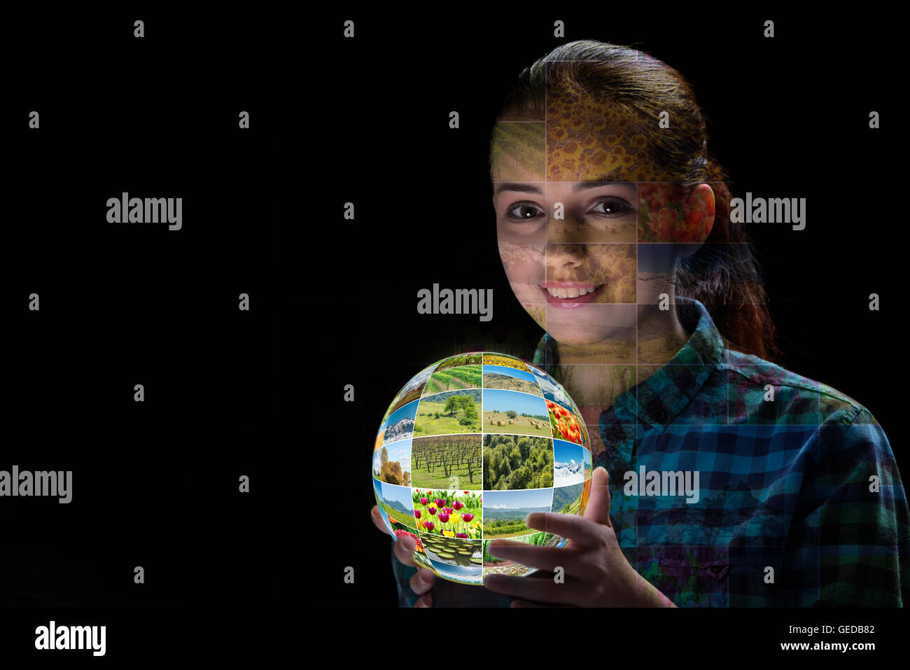 Young woman holding earth with nature photos Stock Photo - Alamy