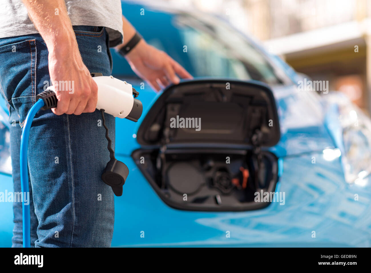 Man closing a fuel tank Stock Photo - Alamy
