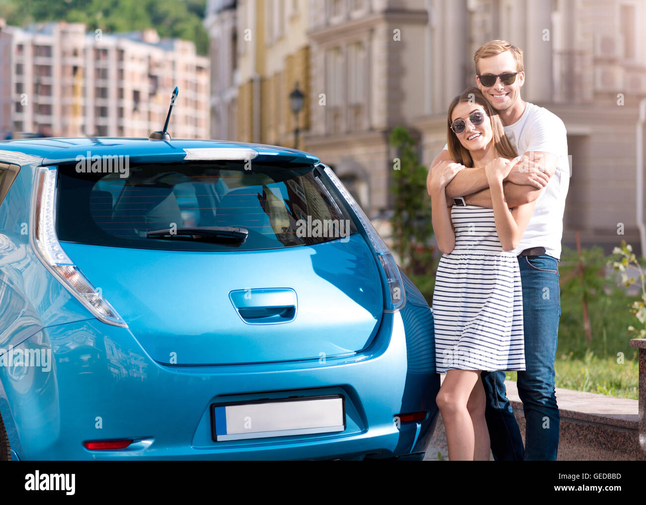 Woman man hugging near car hi-res stock photography and images - Alamy