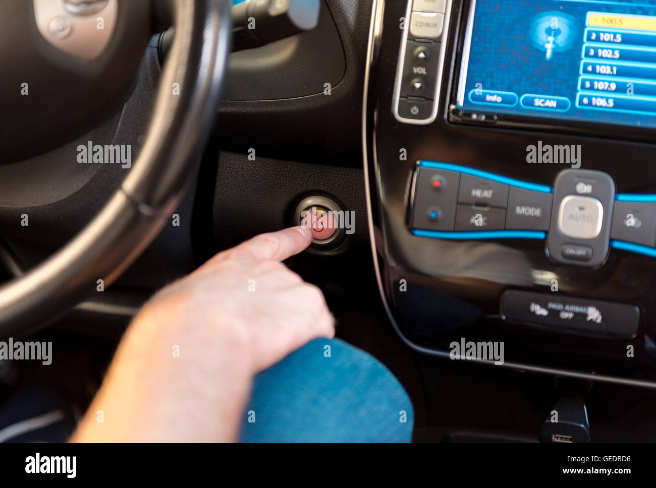 Finger of man switching on car Stock Photo - Alamy