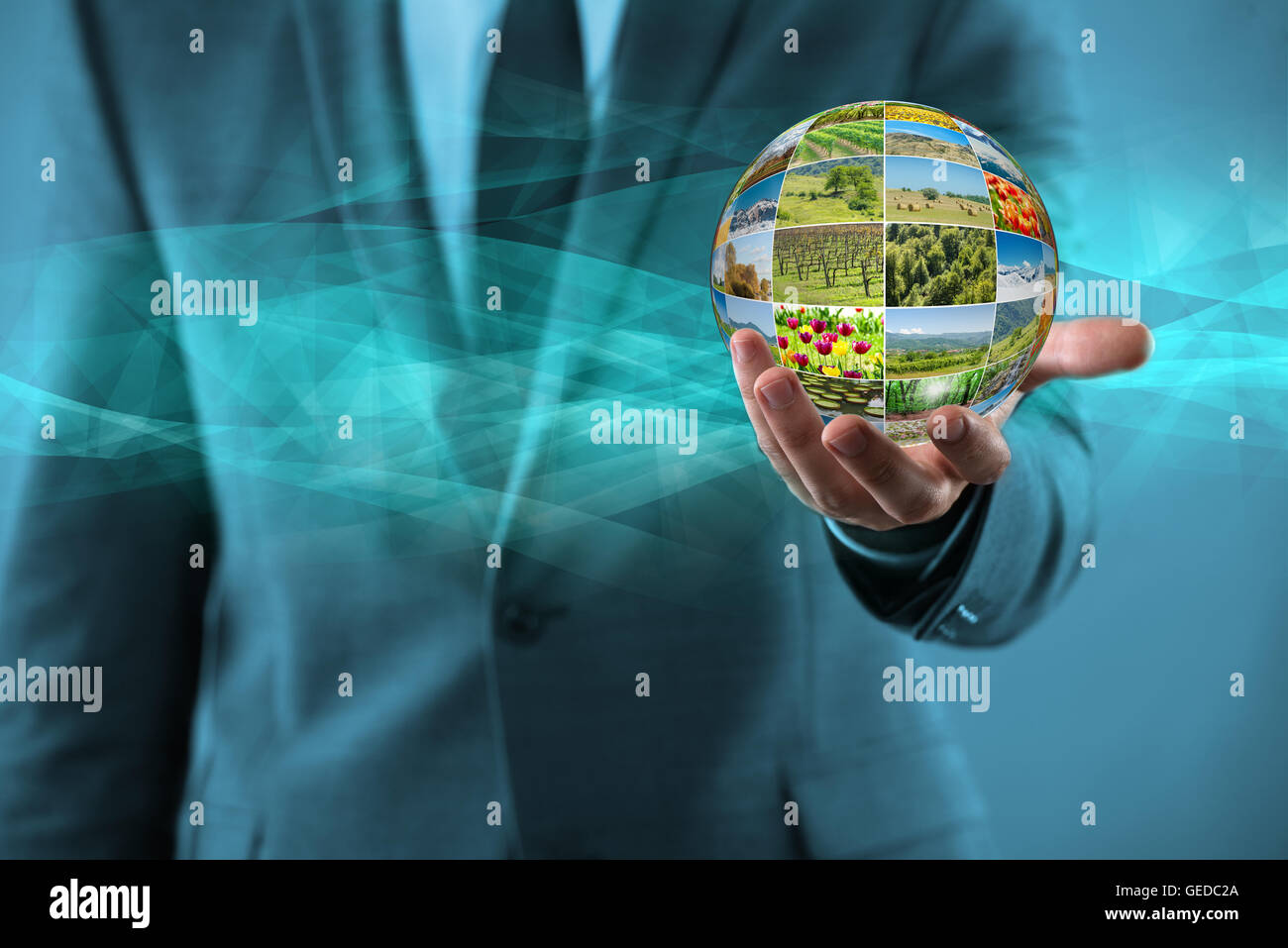 Man holding earth with nature photos Stock Photo - Alamy