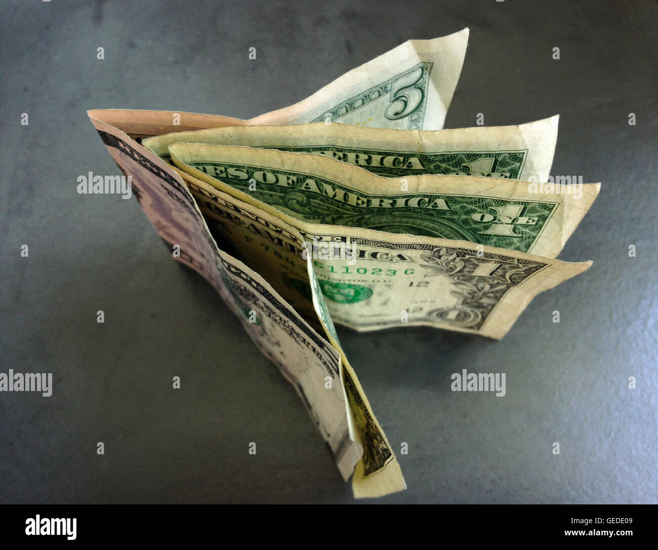 Money / paper bills on gray textured background Stock Photo - Alamy