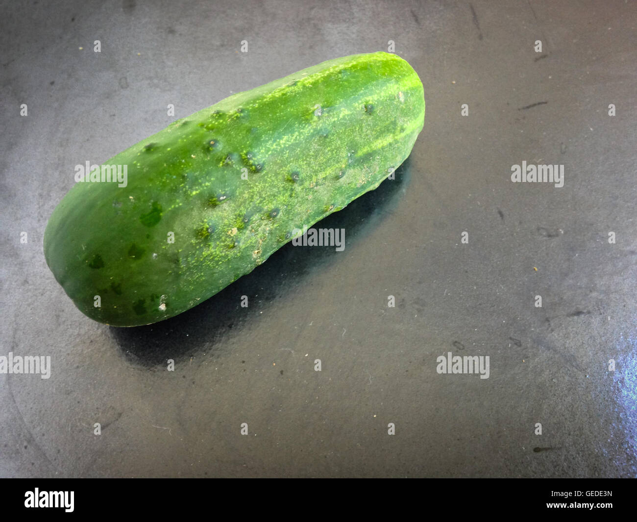 Vegetable on gray textured background. Green cucumber Stock Photo - Alamy