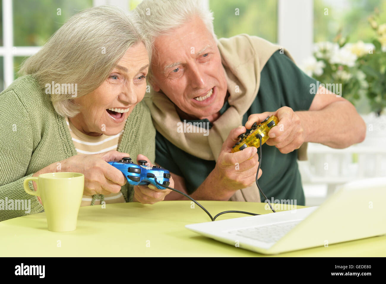 Senior woman playing video games hi-res stock photography and images ...