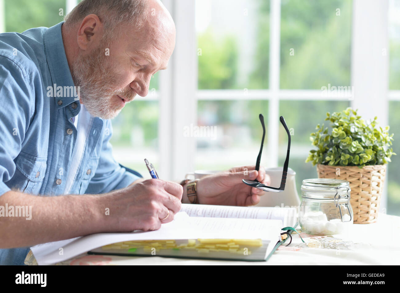 happy man with book Stock Photo - Alamy