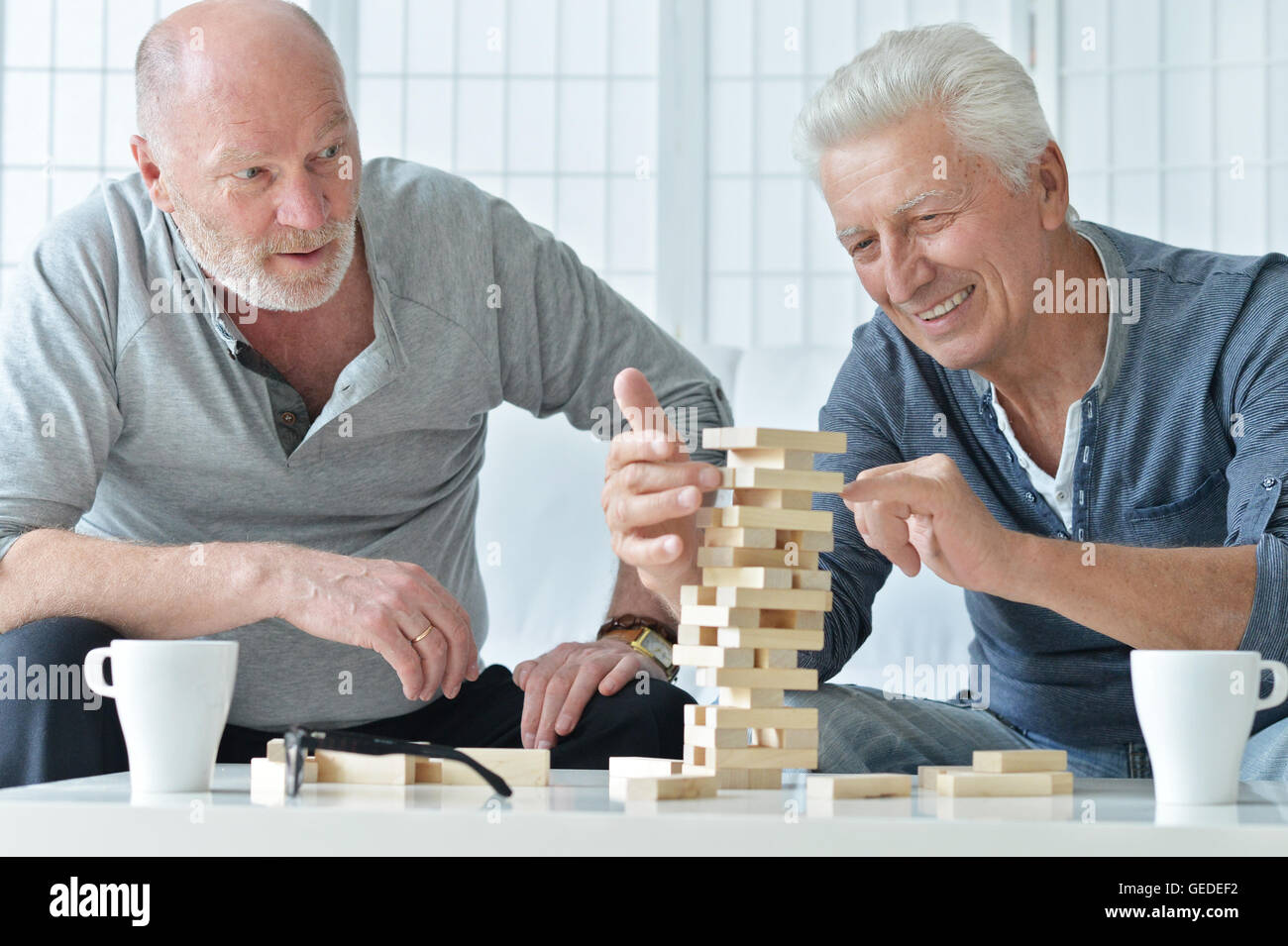 senior men playing board game Stock Photo - Alamy