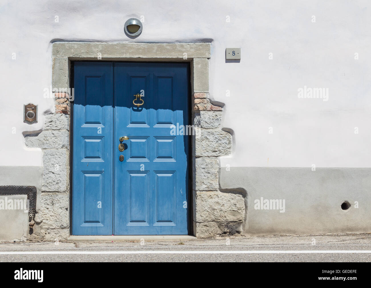 Blue wooden front door to the house in Italy Stock Photo - Alamy