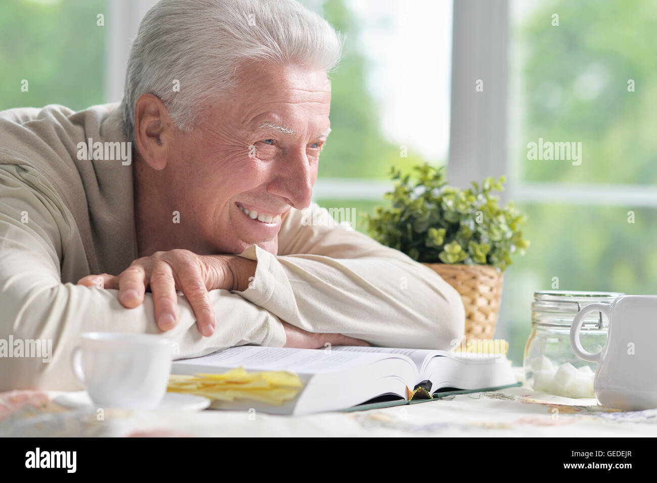 happy man with book Stock Photo - Alamy