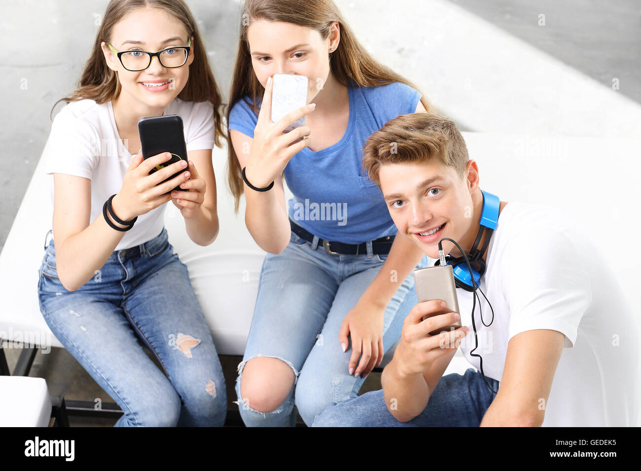 A group of teenagers with cell phones during a break classroom Stock ...