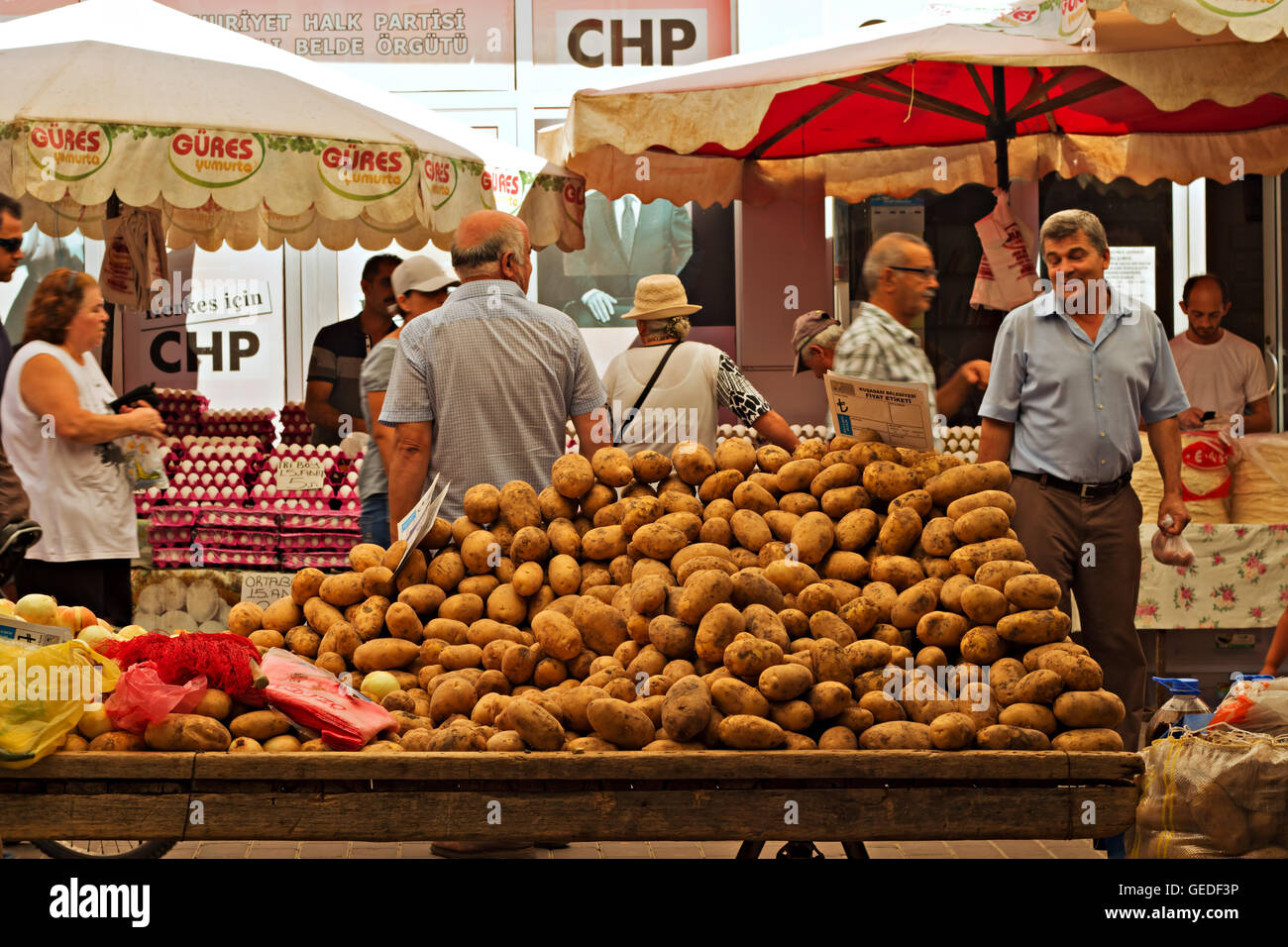 Customers browse a potato stall at a Turkish market Stock Photo - Alamy