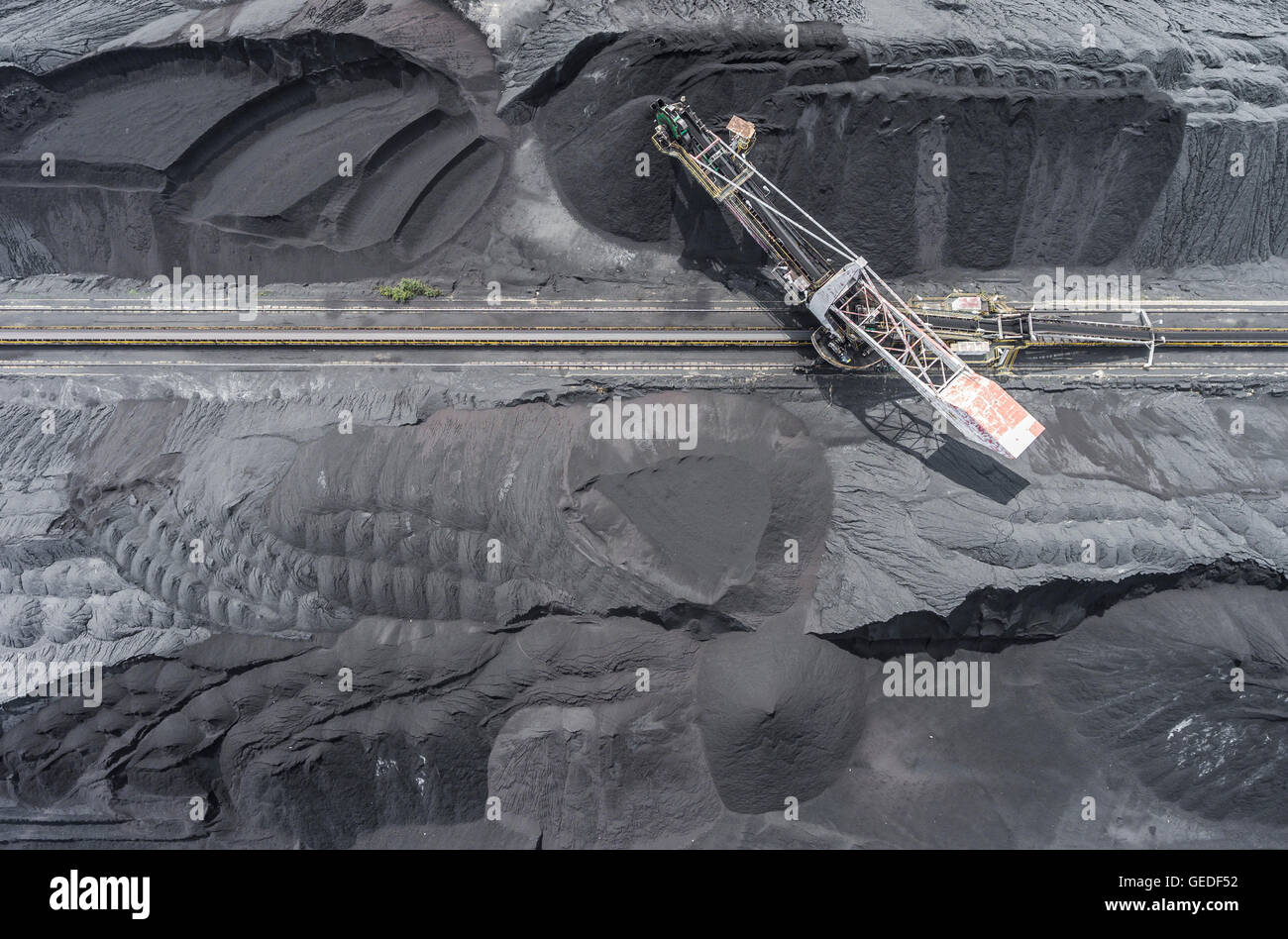 Mining excavator on the bottom surface mine. Brown coal deposits. View ...