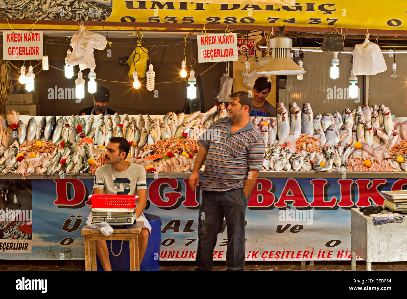 Stallholders on their fishmongers stall on a Turkish market Stock Photo ...