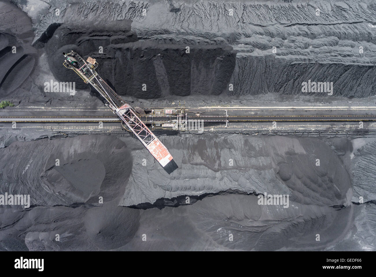 Mining excavator on the bottom surface mine. Brown coal deposits. View ...