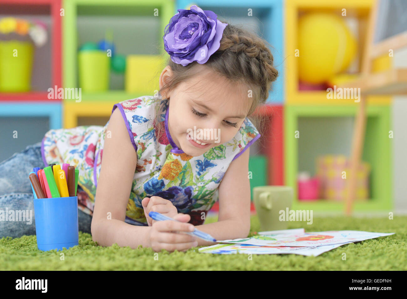 Little girl drawing at class Stock Photo - Alamy