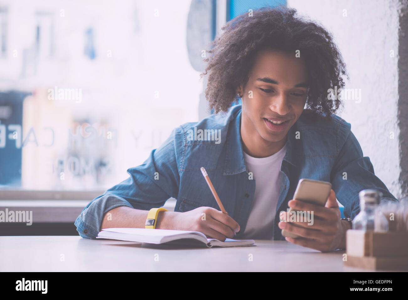 Young confident man writing news Stock Photo - Alamy