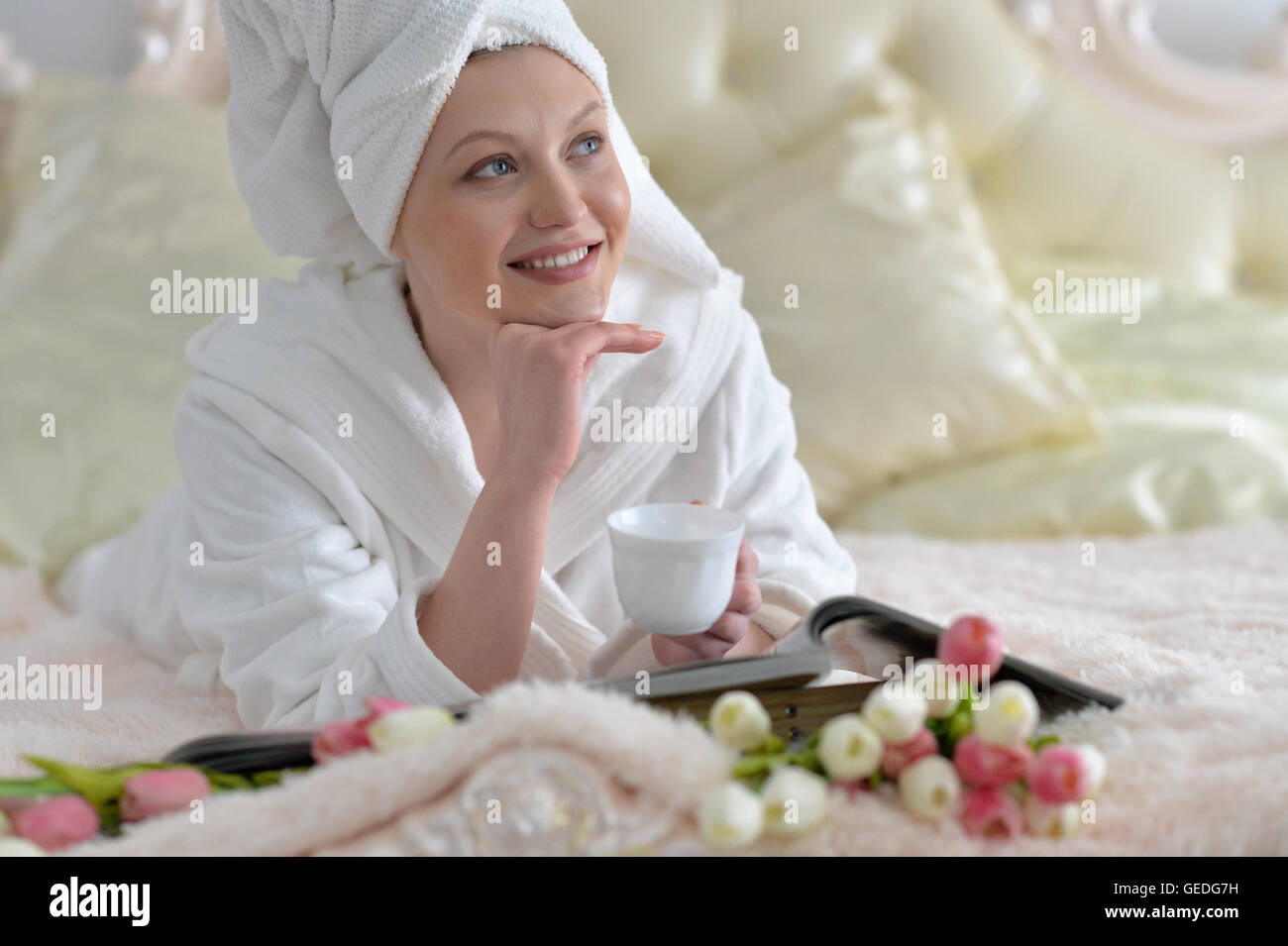 Woman wearing robe drinking coffee hi-res stock photography and images ...