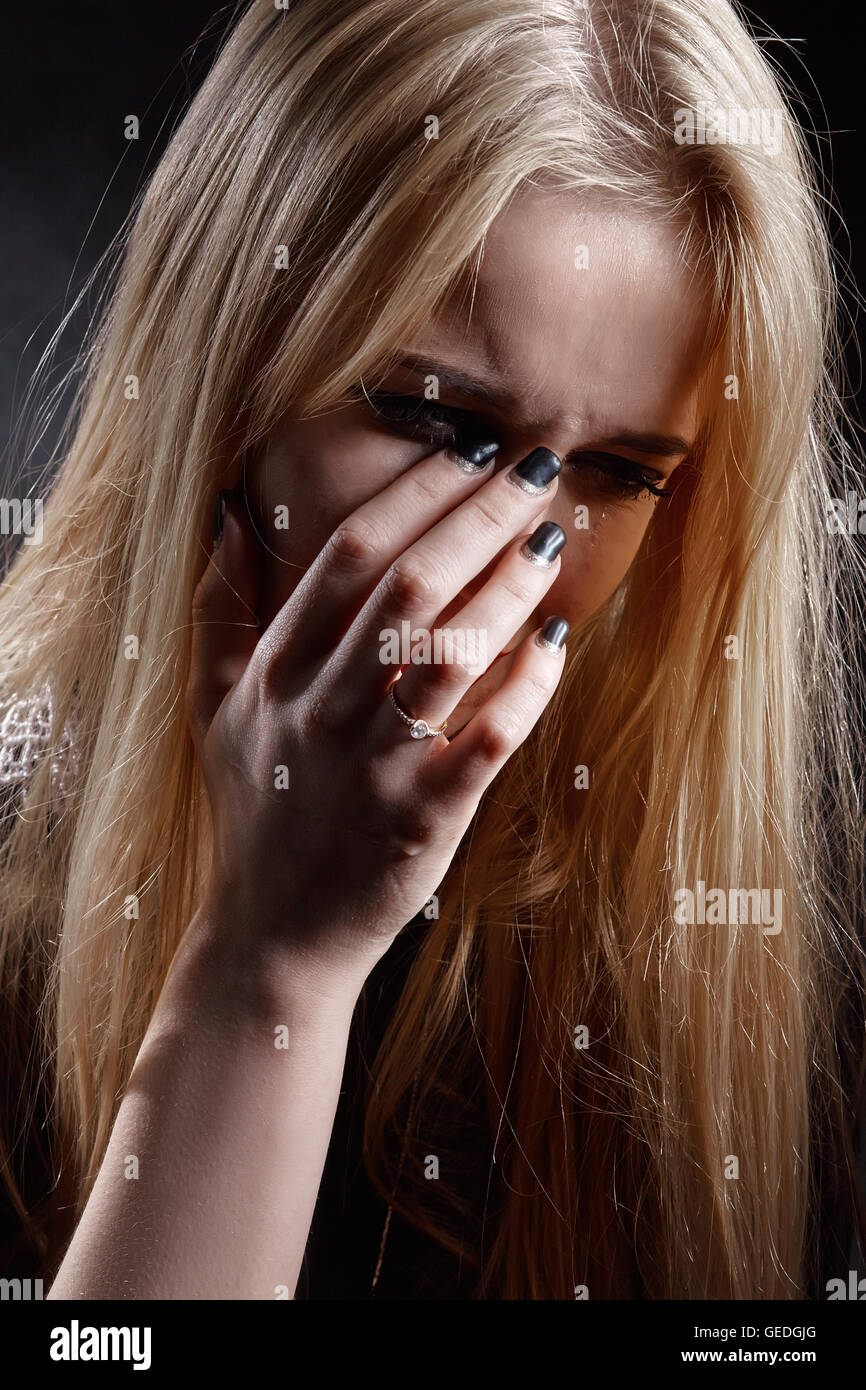 sad girl crying covering her face Stock Photo - Alamy