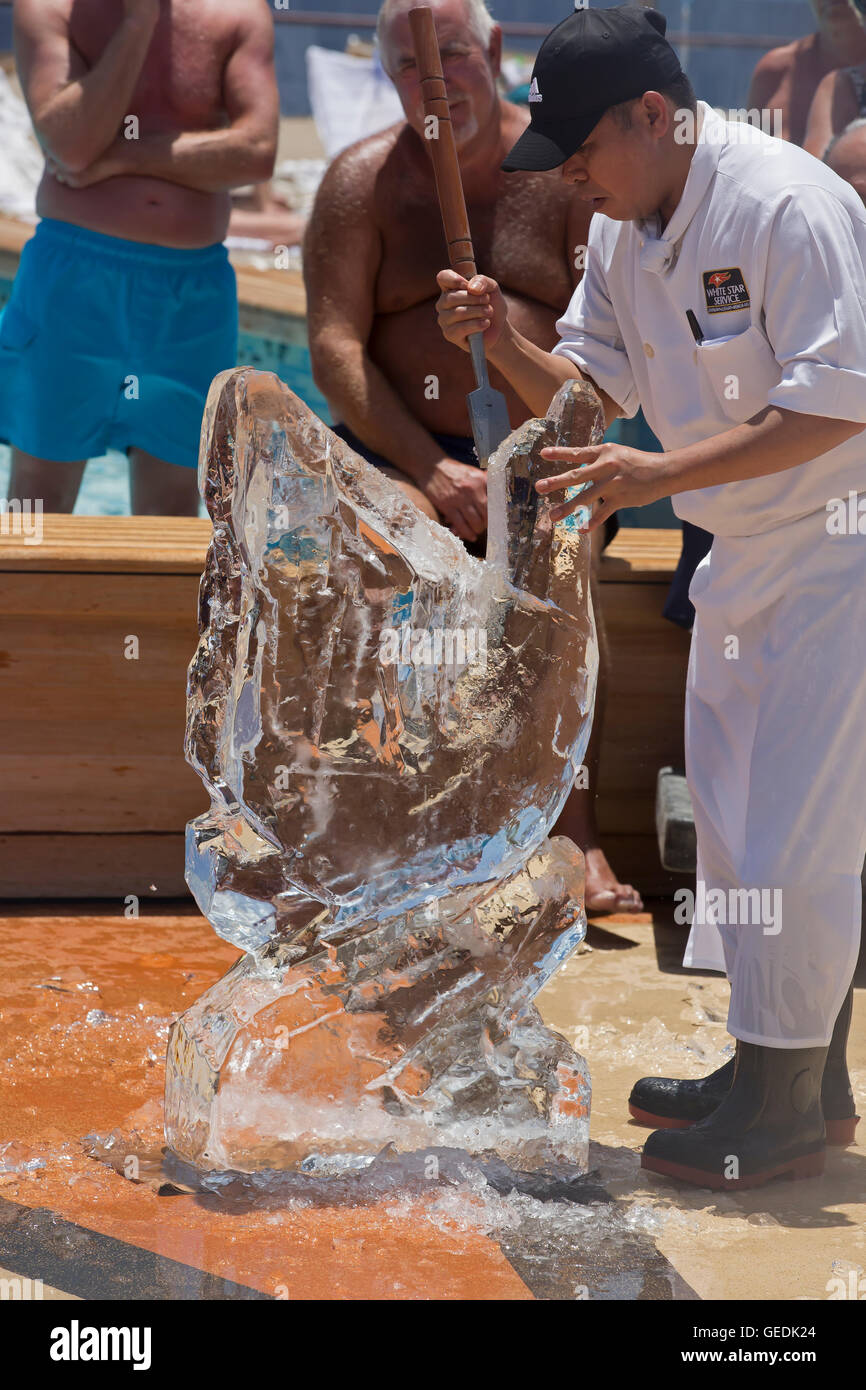 A member of the ships crew demonstrates ice carving on board Cunard's ...