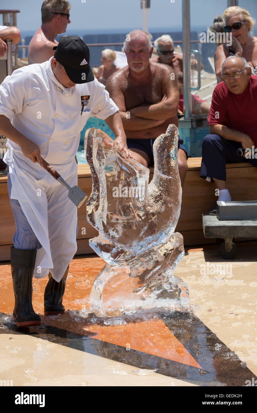 A member of the ships crew demonstrates ice carving on board Cunard's ...