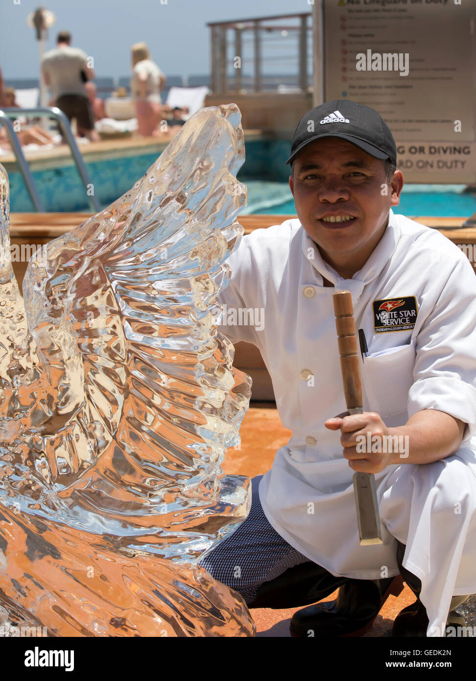 A member of the ships crew demonstrates ice carving on board Cunard's ...