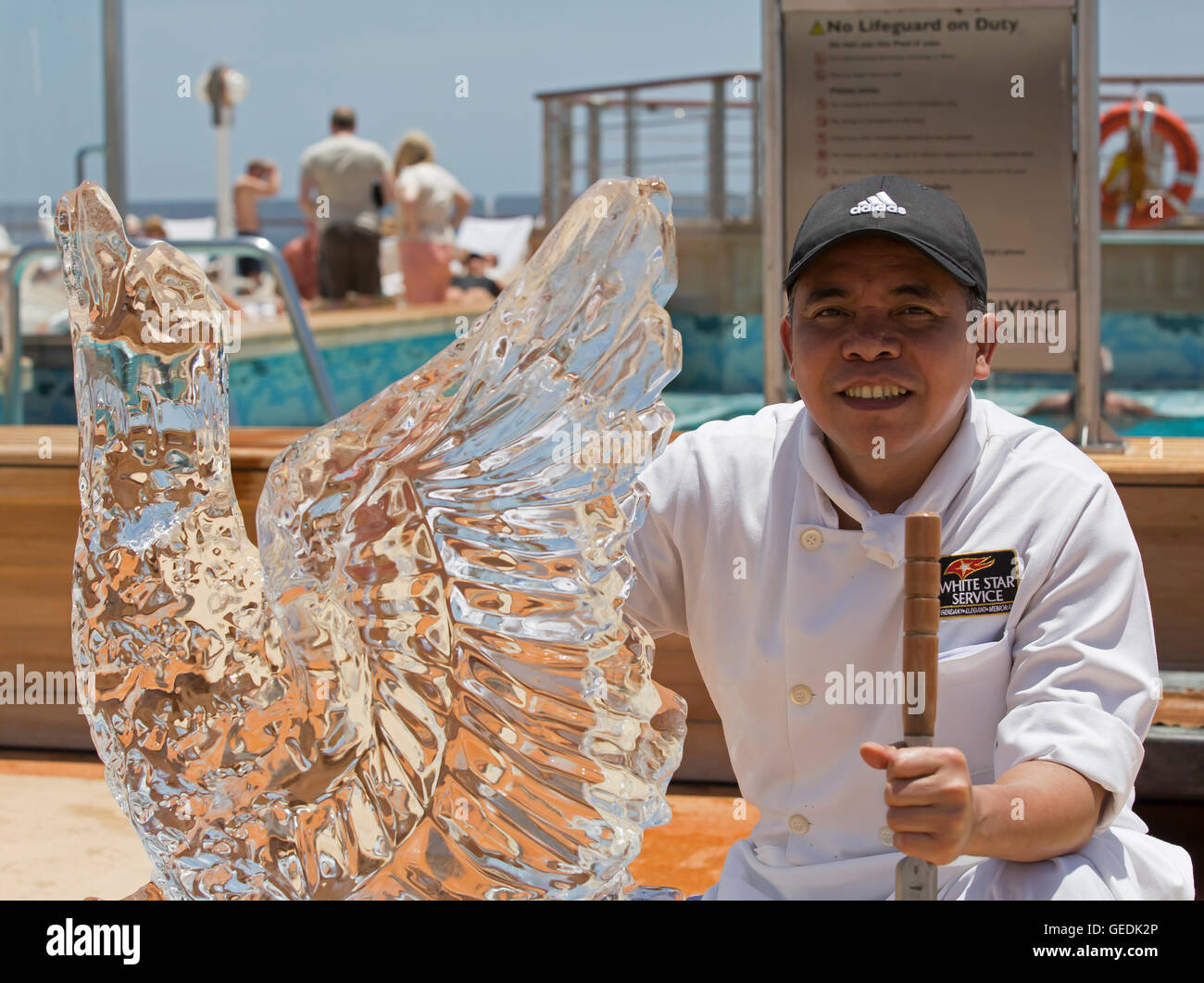 A member of the ships crew demonstrates ice carving on board Cunard's ...