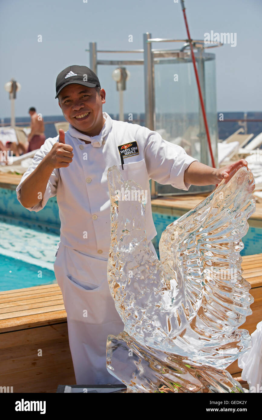 A member of the ships crew demonstrates ice carving on board Cunard's ...