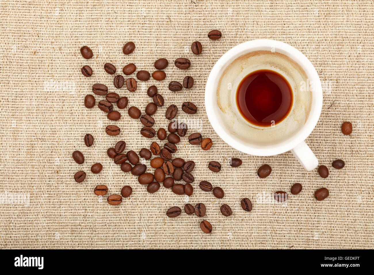 One empty finished white cup of espresso or americano and roasted ...