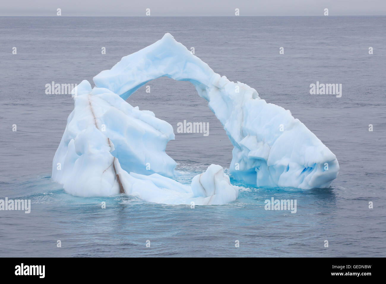 Small iceberg with an arch in front of Brasvellbreen glacier ...