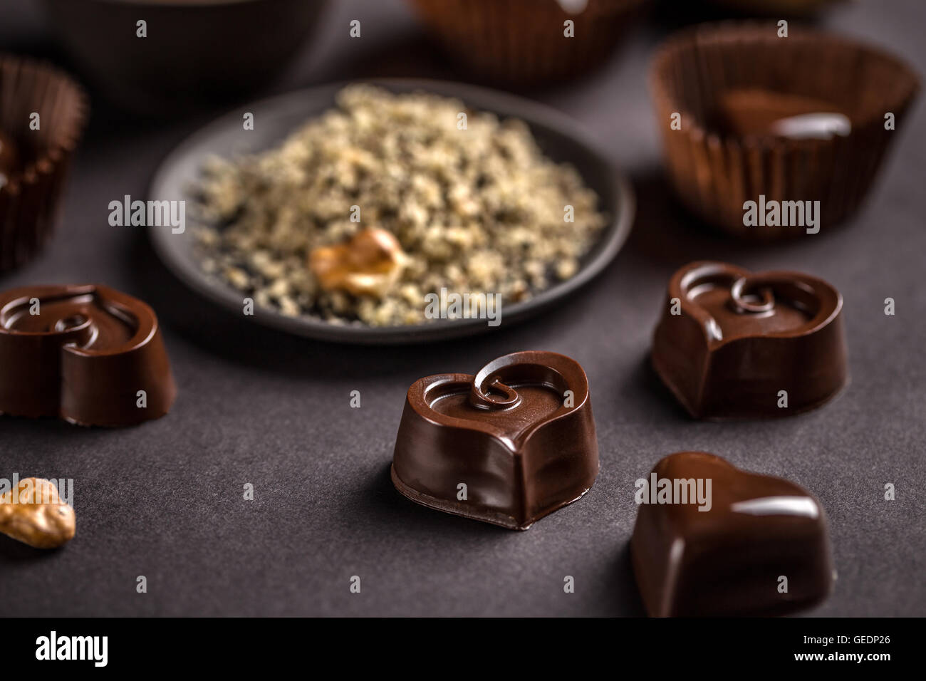 Chocolate sweets on black background Stock Photo - Alamy