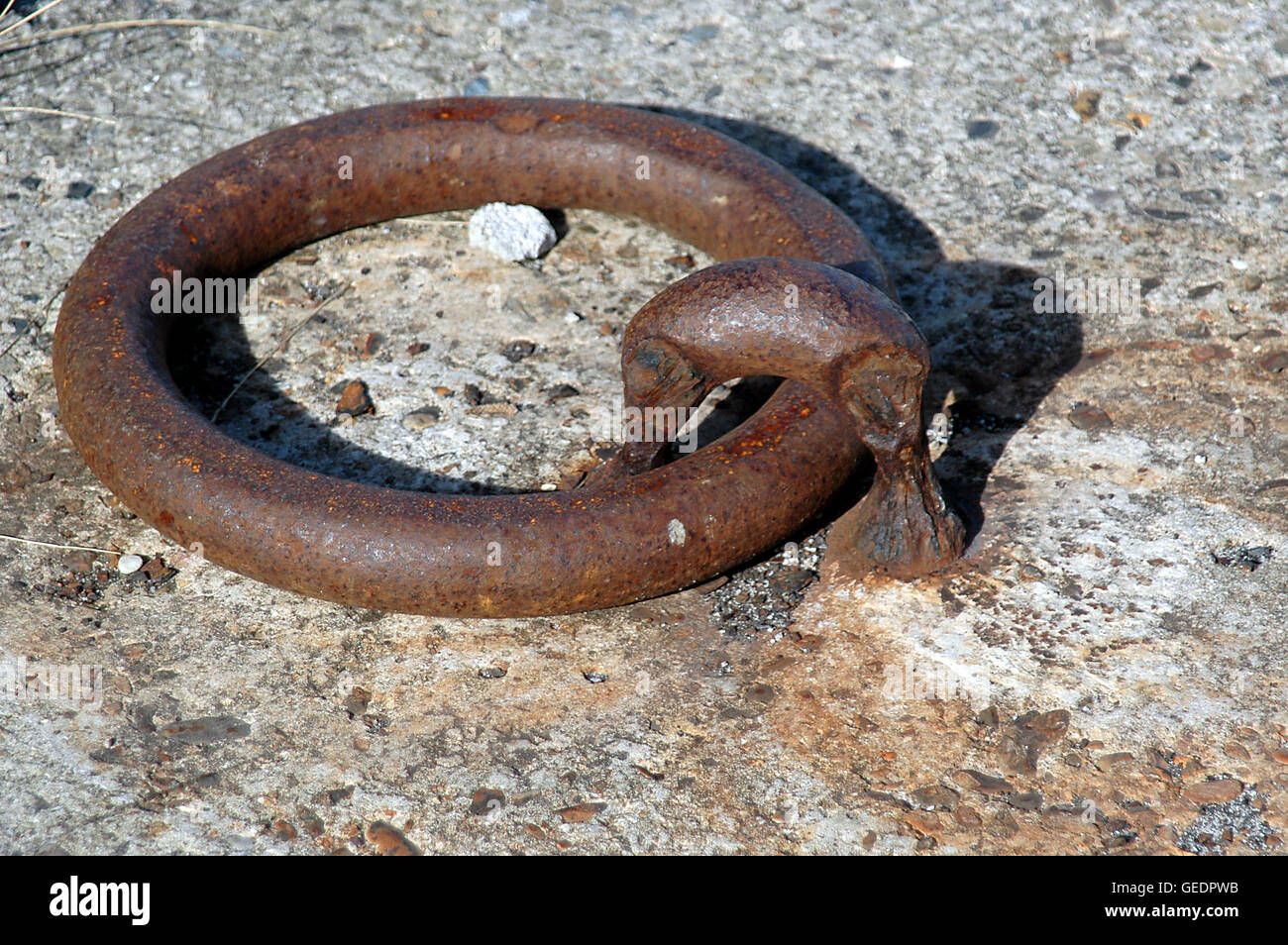 Rusty mooring ring at a small harbor Stock Photo - Alamy