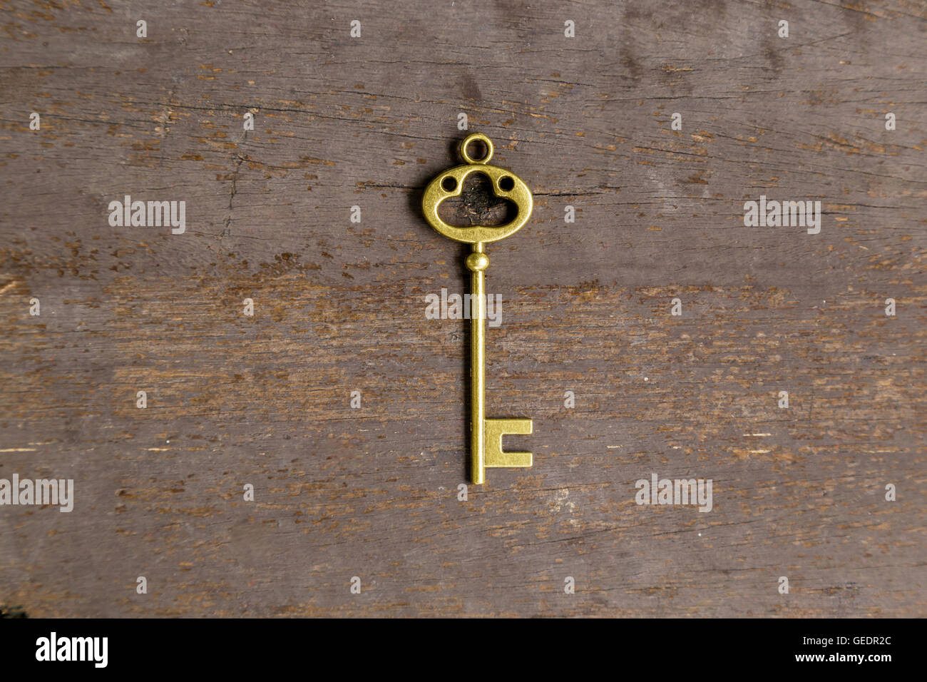 old key on wood background with space Stock Photo - Alamy