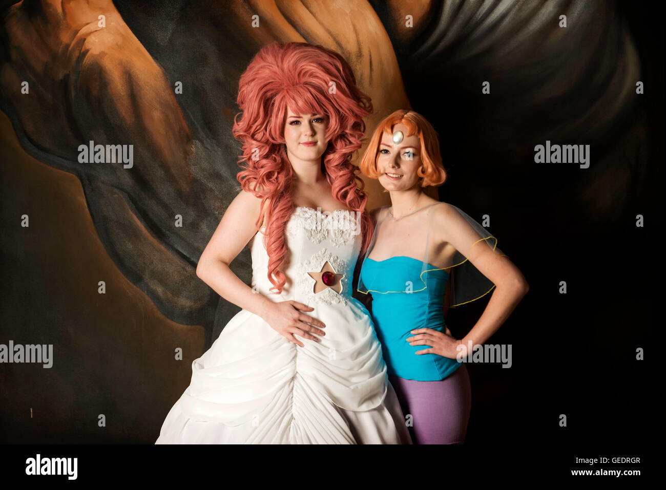 Cosplayers pose for photographs at a Comic Con convention Stock Photo ...