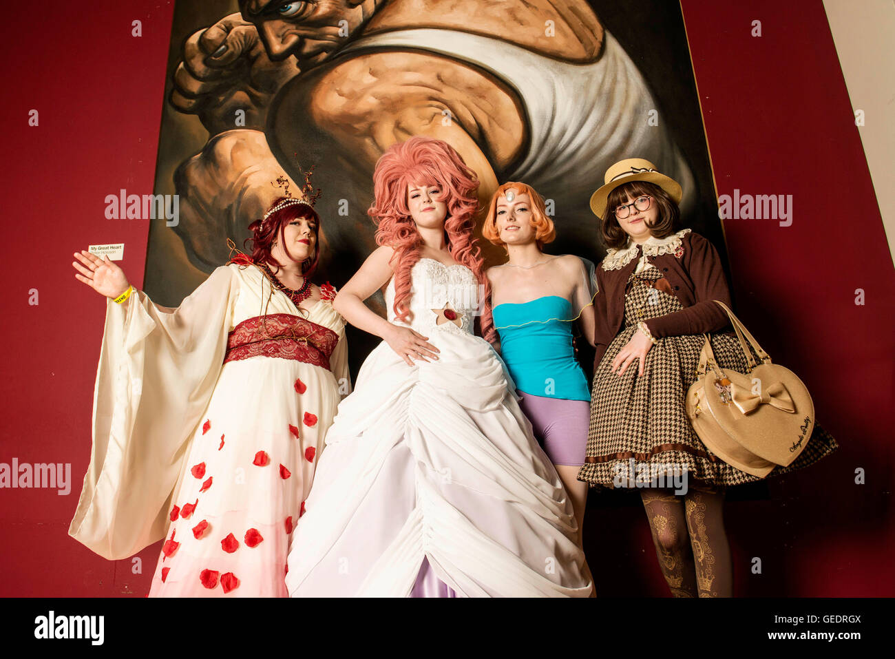 Cosplayers pose for photographs at a Comic Con convention Stock Photo ...
