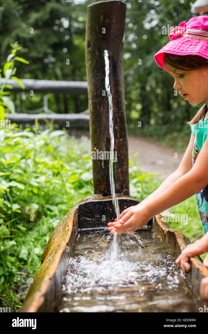 Girl collecting water hi-res stock photography and images - Alamy