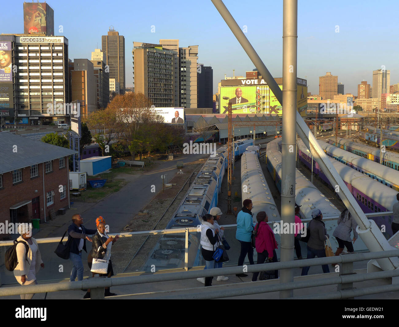 Pedestrian walking across the Nelson Mandela Bridge in Johannesburg ...