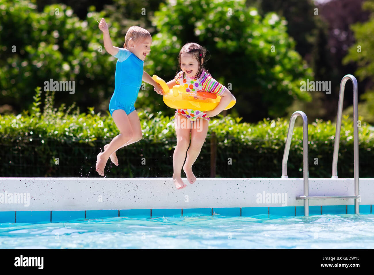 Kids jumping pool summer friends hi-res stock photography and images ...