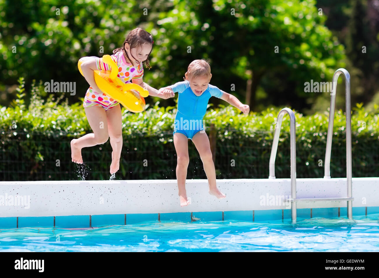 Kids jumping pool summer friends hi-res stock photography and images ...