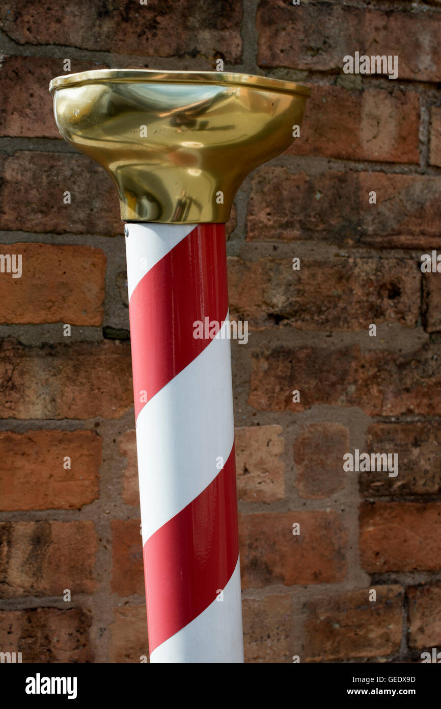 A red and white striped barber`s pole, UK Stock Photo - Alamy