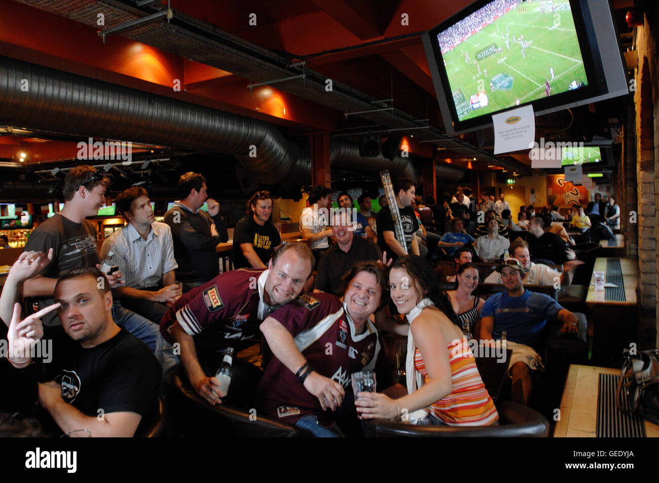 Drinkers, diners and spectators of an Aussie rugby league game. The ...
