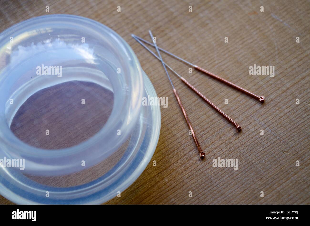 Acupuncture needles & silicone cup Stock Photo - Alamy