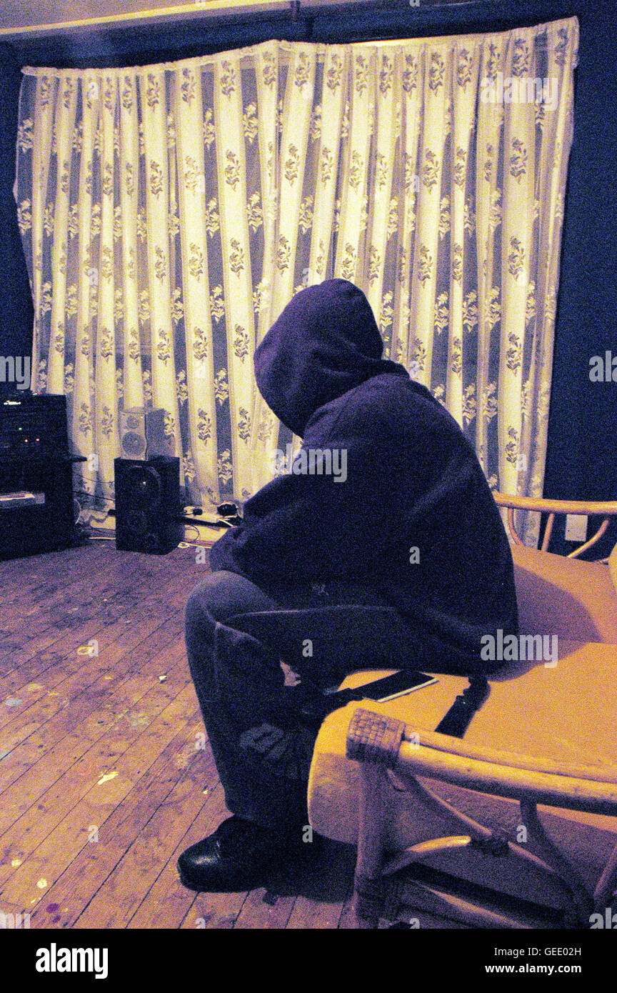 A member of the 'Muslim Boys' gang pictured in a safe house in Peckham ...