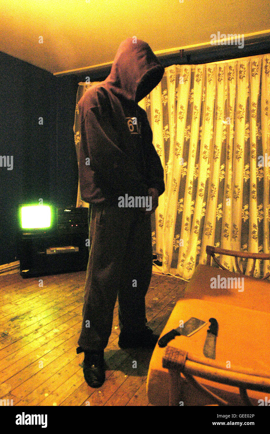 A member of the 'Muslim Boys' gang pictured in a safe house in Peckham ...