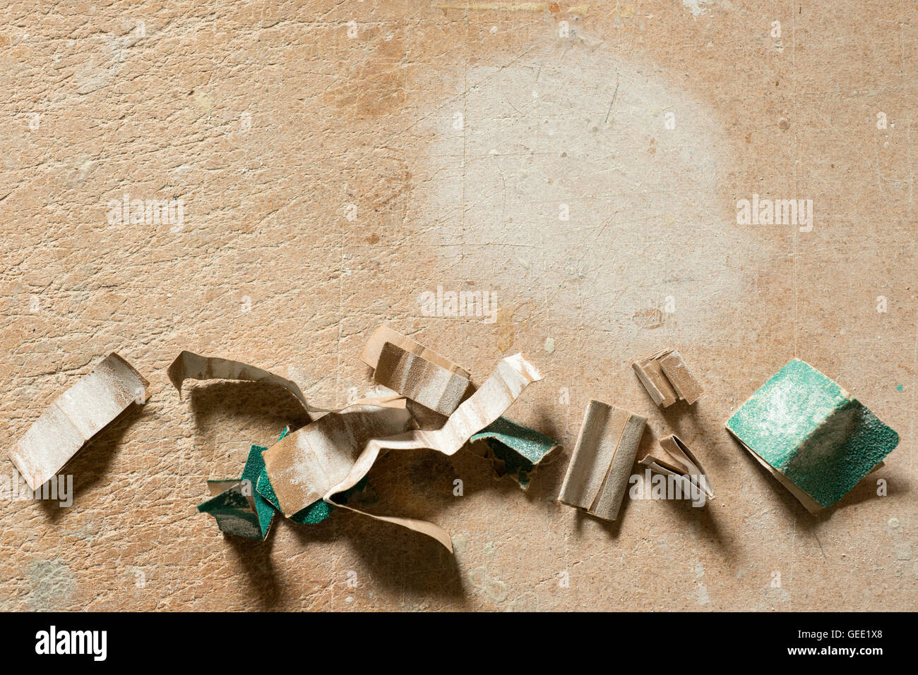 Pieces of used sandpaper on work wooden surface with copy space Stock ...