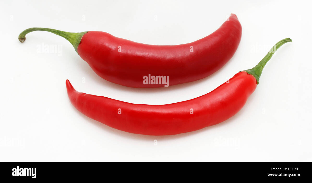 Two red hot chili peppers Stock Photo - Alamy