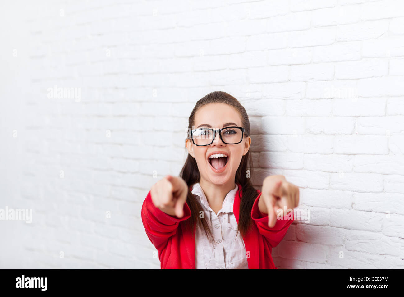 Businesswoman happy excited laughing point finger at you wear red ...