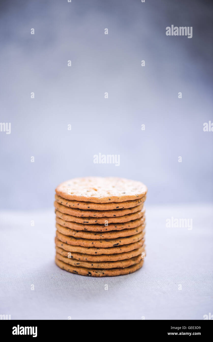 stack of round cheese crackers, copy space Stock Photo - Alamy